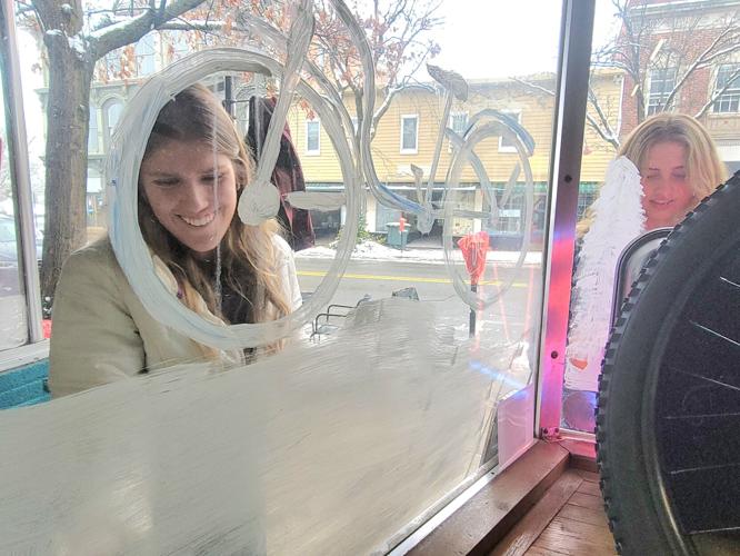Lewisburg art students paint Market Street with winter-themed murals ...