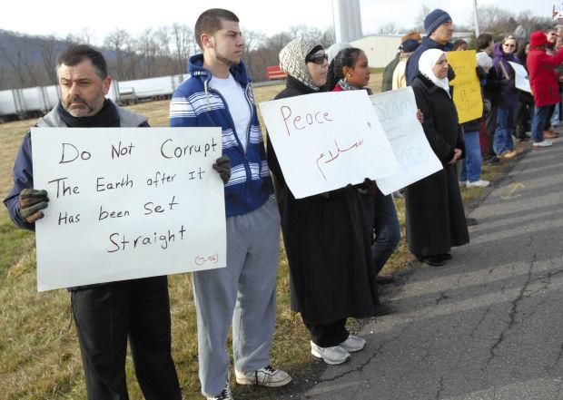 Dozens protest speaker | News | dailyitem.com