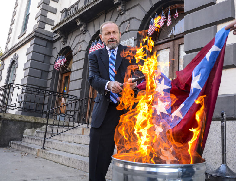 Activist ignites discussion by burning Nazi-Confederate flag | Local ...