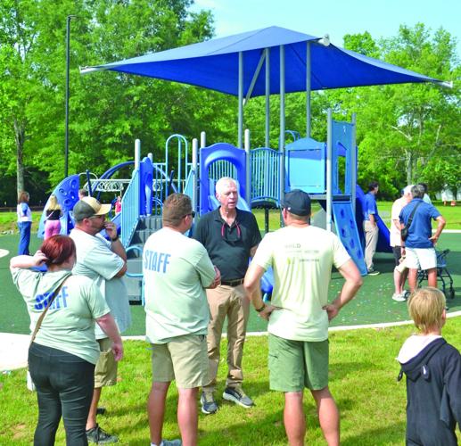 Local officials, residents celebrate grand re-opening of Heritage Park ...
