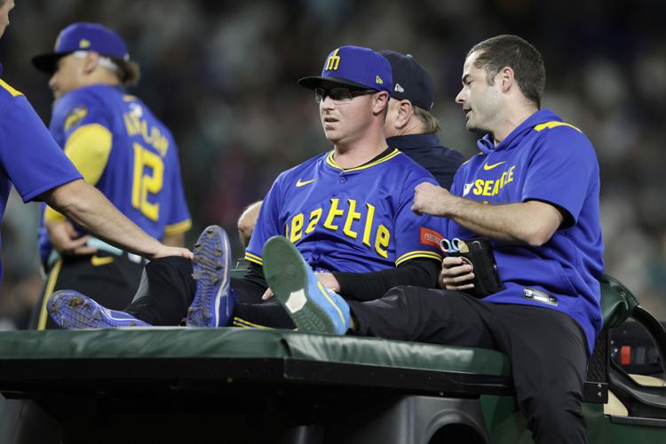 Mariners reliever Trent Thornton carted off field after injury coming ...