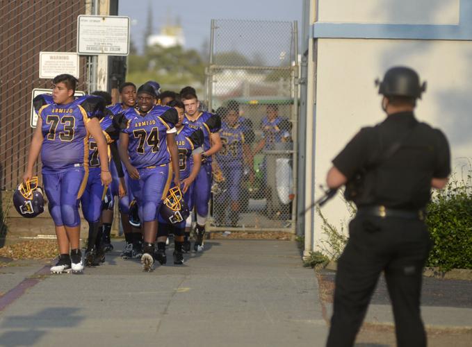 Police report 2 shot, 1 dead; 2 in custody after gunfight shuts down ...