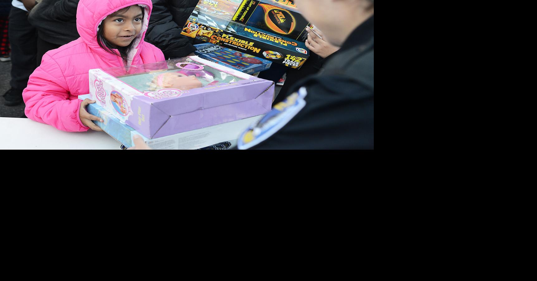 Toy giveaway lights up faces, lives of neighborhood children | Singing ...