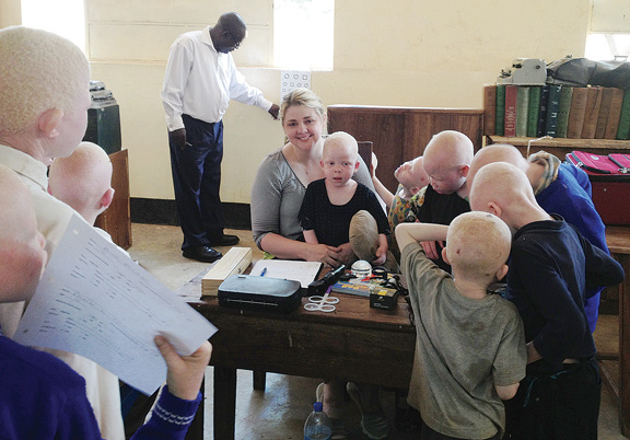 Dr. Ashley Risner helps children with albinism with their vision during ...