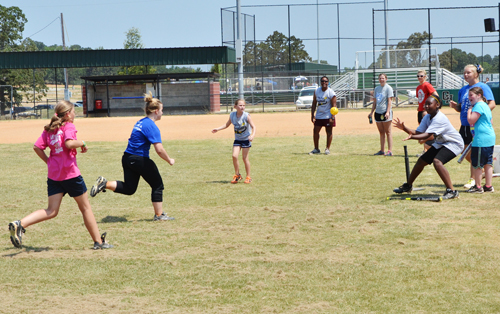 McMichael teaches fundamentals to students at her softball camp ...