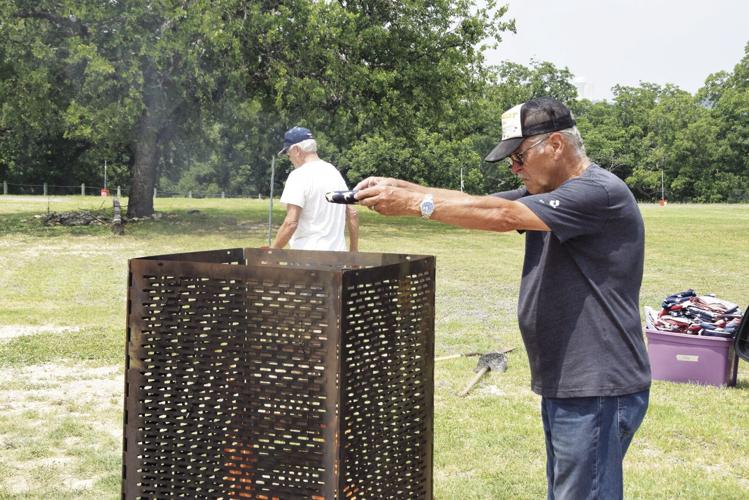 Worn and frayed flags retired honorably with flames | News | dailytimes.com