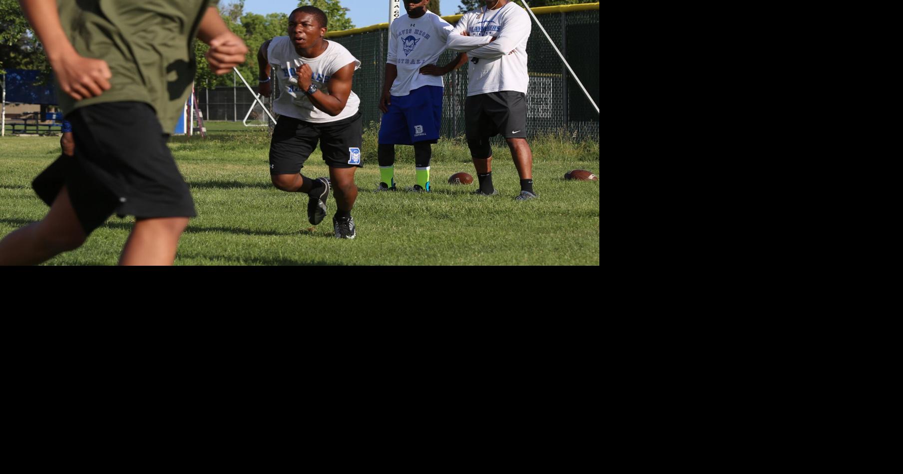 Christian McCoy and coaches John Wiley and Ty Brown DHS football spring ...