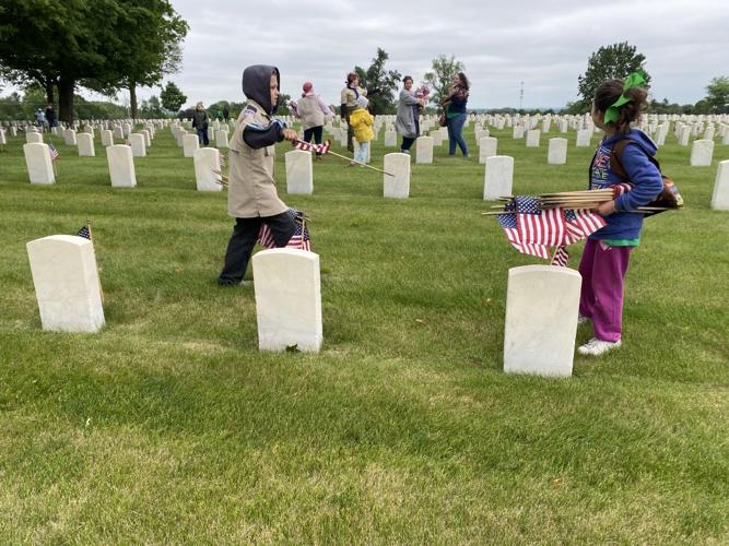 Scouts return to Dayton National Cemetery to place flags on graves ...