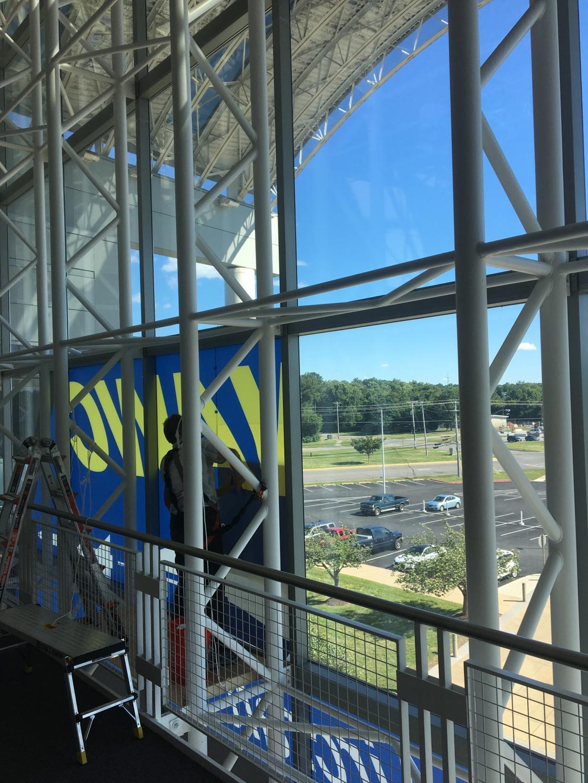 NAWCAD increases visibility with two-story tall logo installation ...