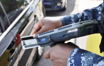 Access Granted: Scanners verify credentials before allowing entry ...