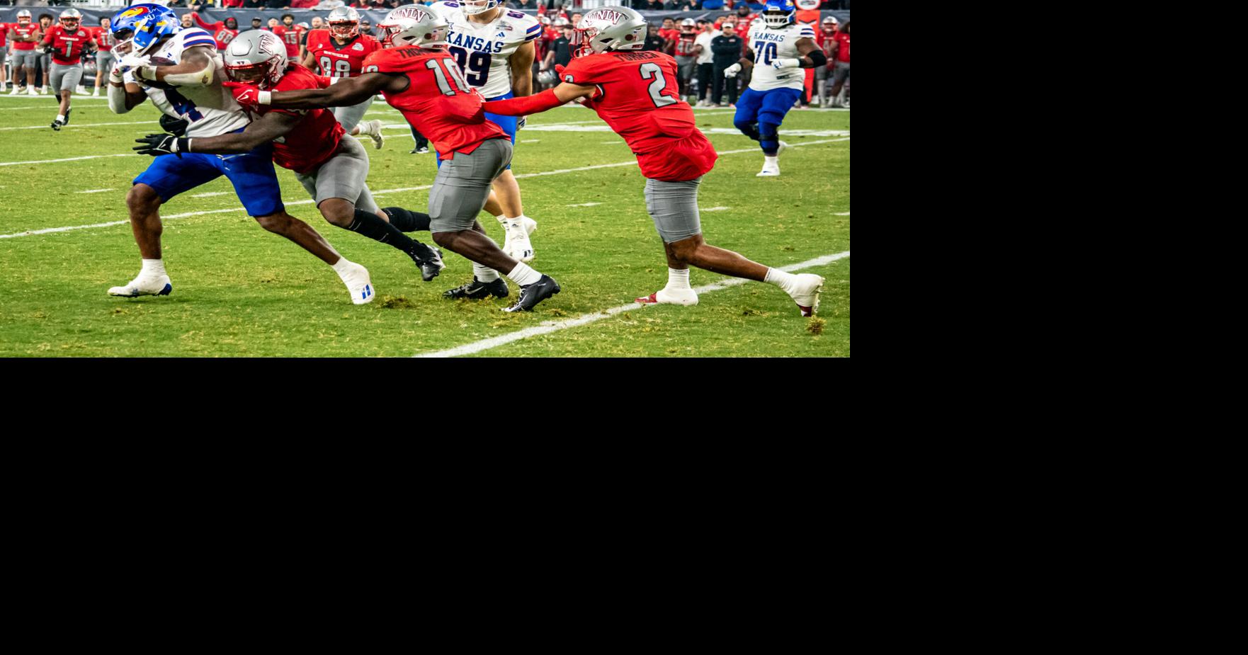 Bean throws for 6 TDs, Kansas overcomes flags to beat UNLV 49-36 in ...