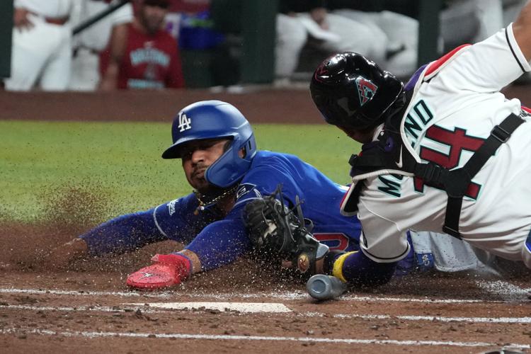 Marte, Arenado hit clutch homers to lift D-backs over Dodgers 4-1 ...