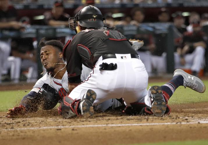 Swanson saves Braves in 10th for 5-4 win over Diamondbacks | Sports ...