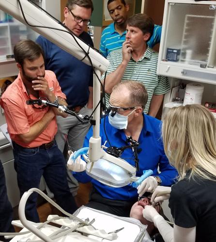 Local dentist born with missing teeth inspired to treat complex dental ...