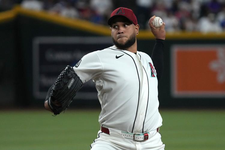 Marte, Arenado hit clutch homers to lift D-backs over Dodgers 4-1 ...