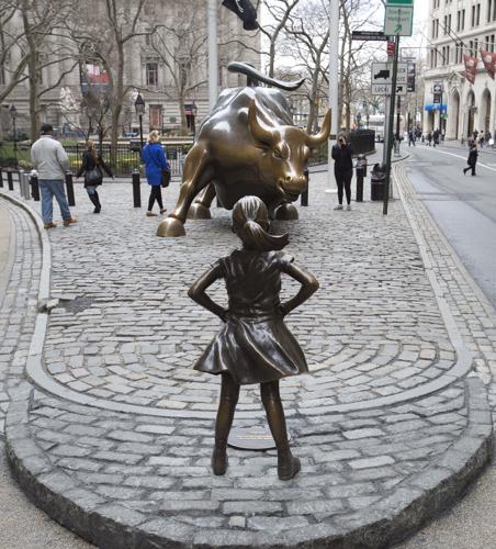 'Fearless Girl' statue stares down Wall Street's iconic bull | Odd ...