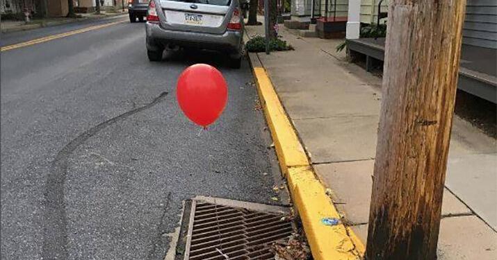 Police ‘terrified’ by red ‘It’ balloons tied to sewer grates | Odd ...
