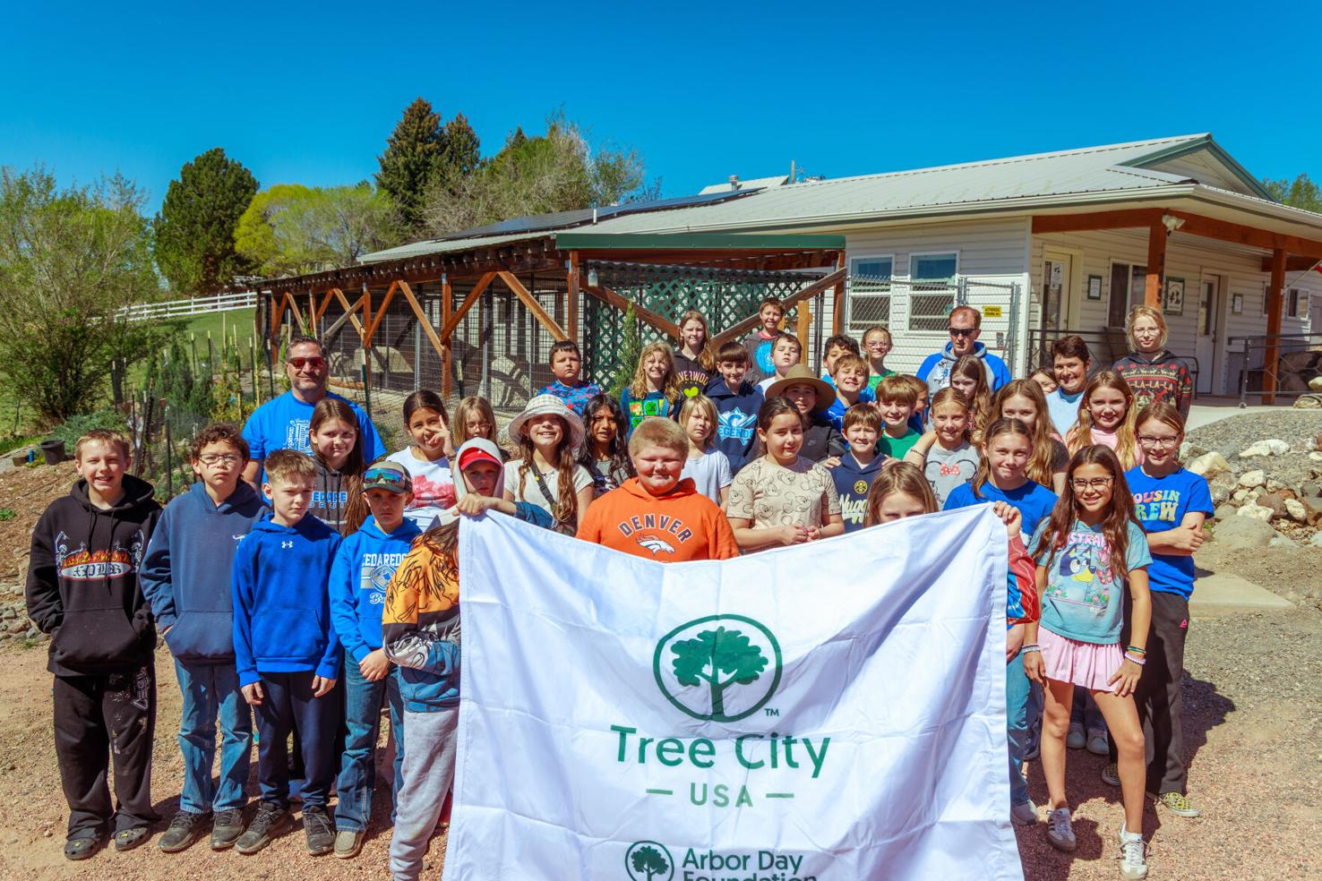 Students plant trees for dogs; Cedaredge fifth grade class helps ...