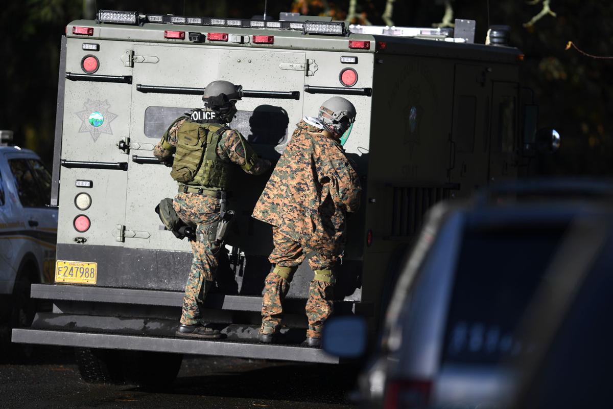 SWAT team compels barricaded suspect to surrender | Crime and Courts ...
