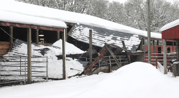 Snow weighs heavily on area: Collapsed structures, crashes and outages