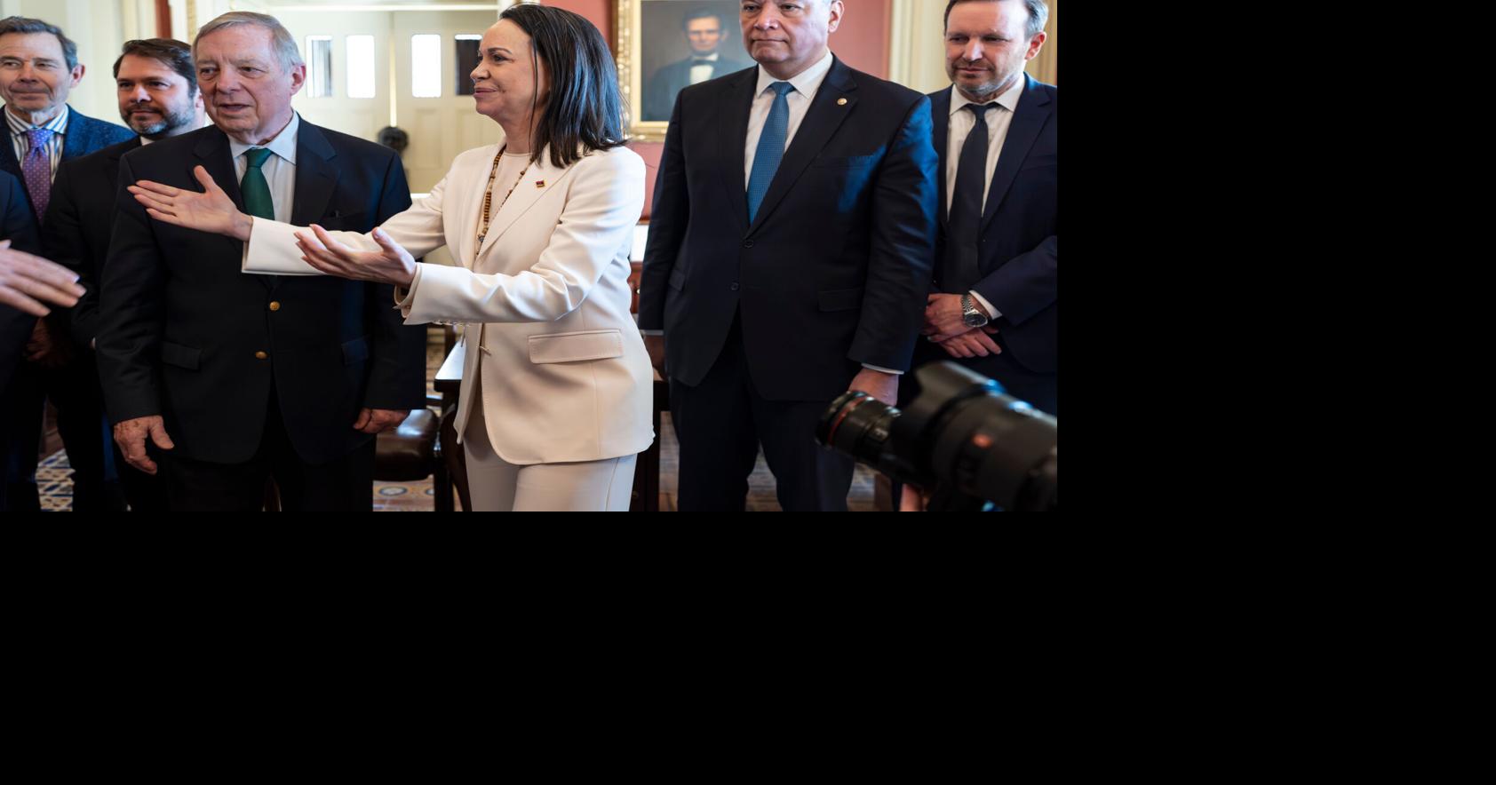 Venezuelan opposition leader presents Nobel prize to Trump