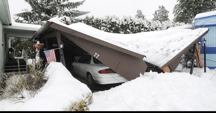 Snow weighs heavily on area: Collapsed structures, crashes and outages