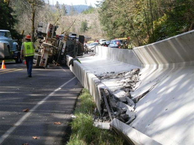 Truck overturns, concrete beam breaks on Highway 126W