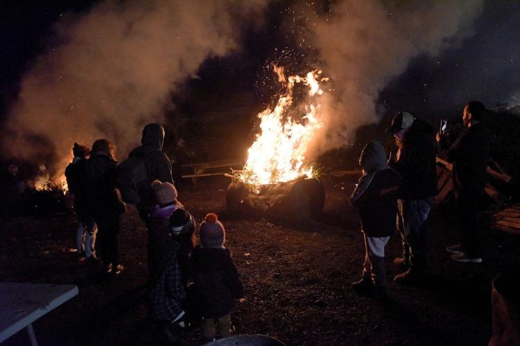 After the holidays: Roaring bonfire burns Christmas trees at J&F Farms ...