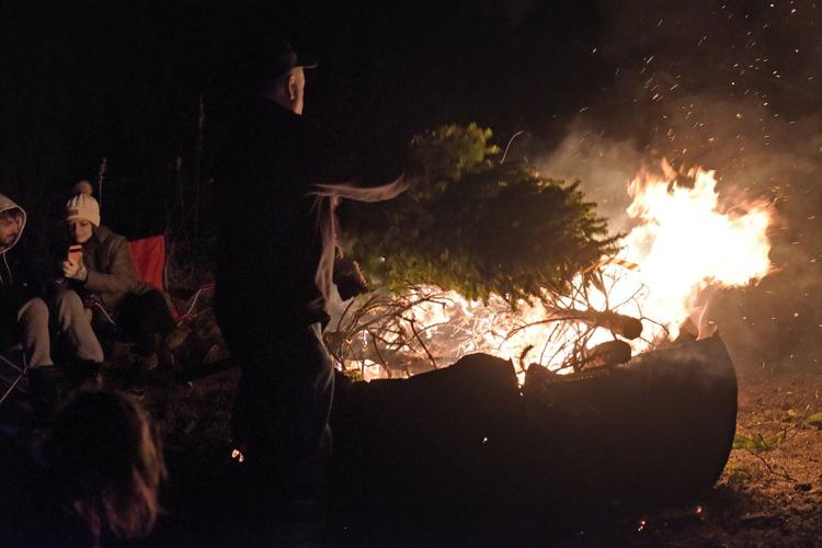 After the holidays: Roaring bonfire burns Christmas trees at J&F Farms ...