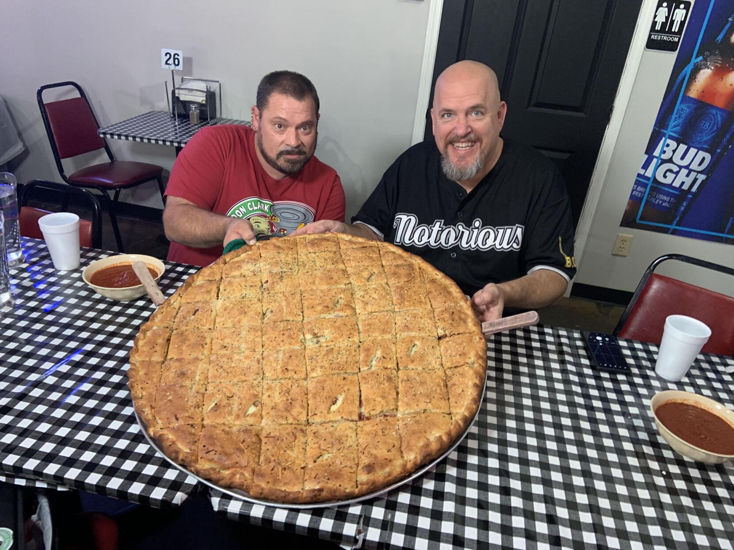 Professional eaters “dispose” of pizza food challenge | News ...