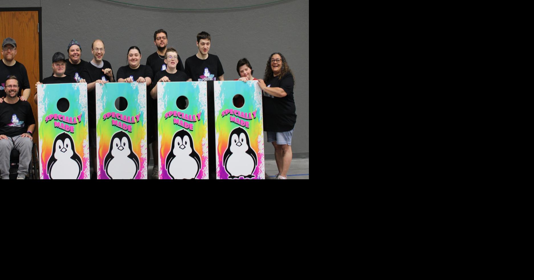 Specially Made Penguins compete in corn hole at Special Olympics ...