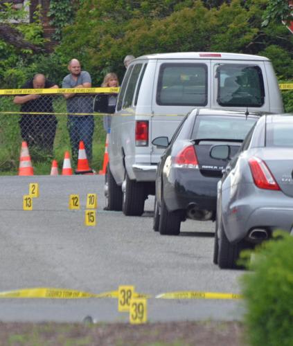 Officer, bystander wounded, suspect dead in Dundalk shooting ...