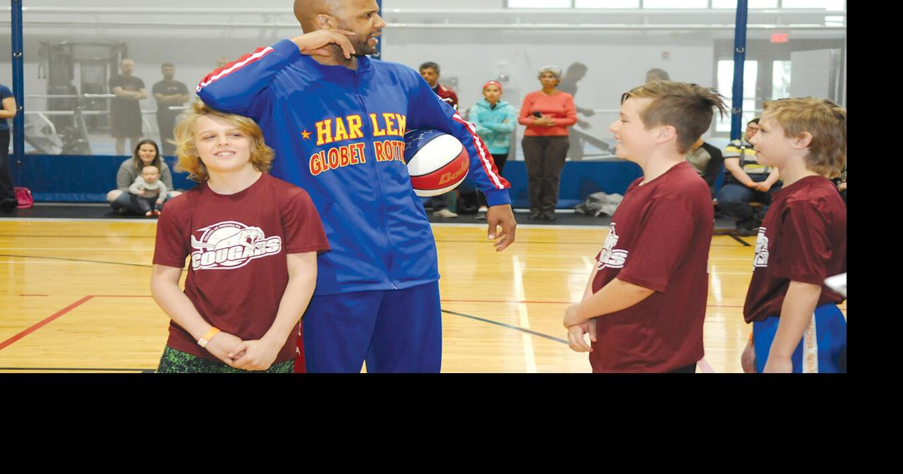 Harlem Globetrotters put balls in baskets and smiles on faces