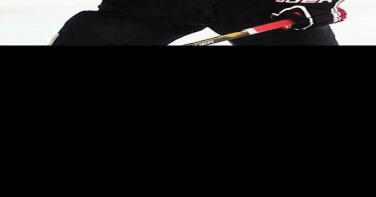 Whitby’s Eric Regan sees the world through hockey