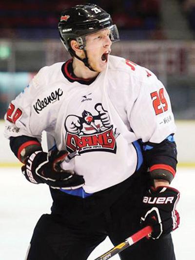 Whitby’s Eric Regan sees the world through hockey