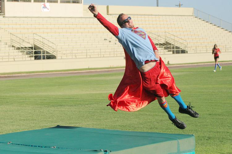 Flexing muscles for a good cause — Superhero Mayhem, Superhero ...