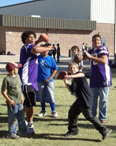 EAC football players have fun with students at Fall Festival | Local ...
