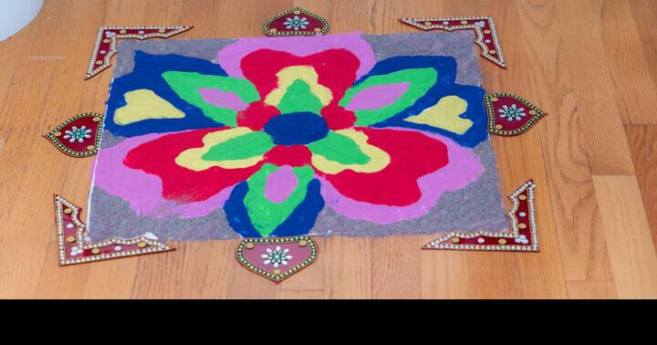 The rangoli design is used during Diwali to welcome positive energy and ...