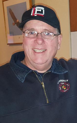 Battling blaze in home, Lawrence firefighter falls backwards down ...