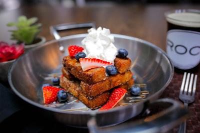 Grubstak piles tasty, locally sourced ingredients atop waffle fries ...
