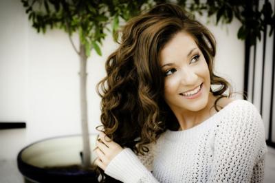 Arizona country singer Laura Walsh shines spotlight on domestic ...