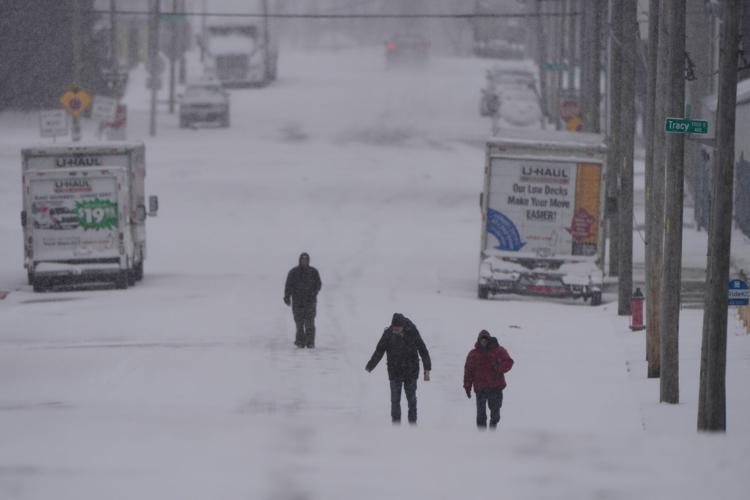 PHOTOS: People brace themselves for the winter storm moving across the ...