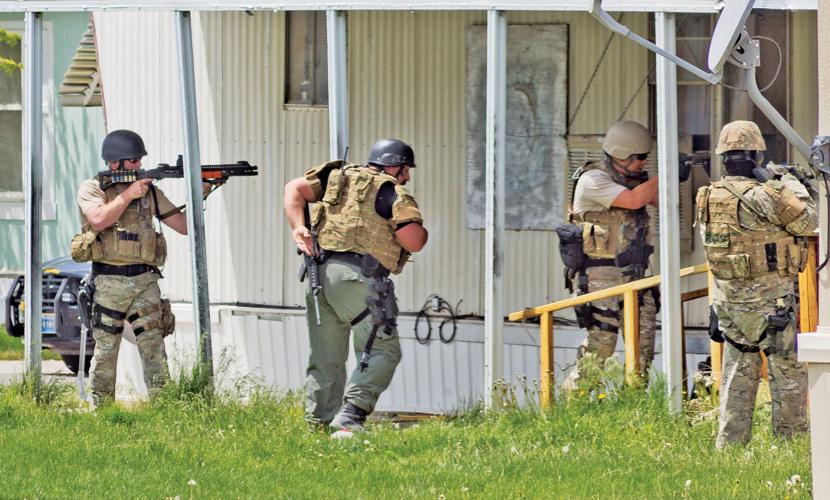 SWAT Standoff: Burglary suspect barricades himself in trailer, surrenders