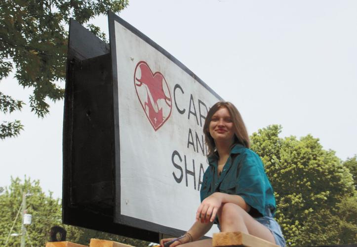 UCHS student gives Care and Share sign a touch-up | Education ...