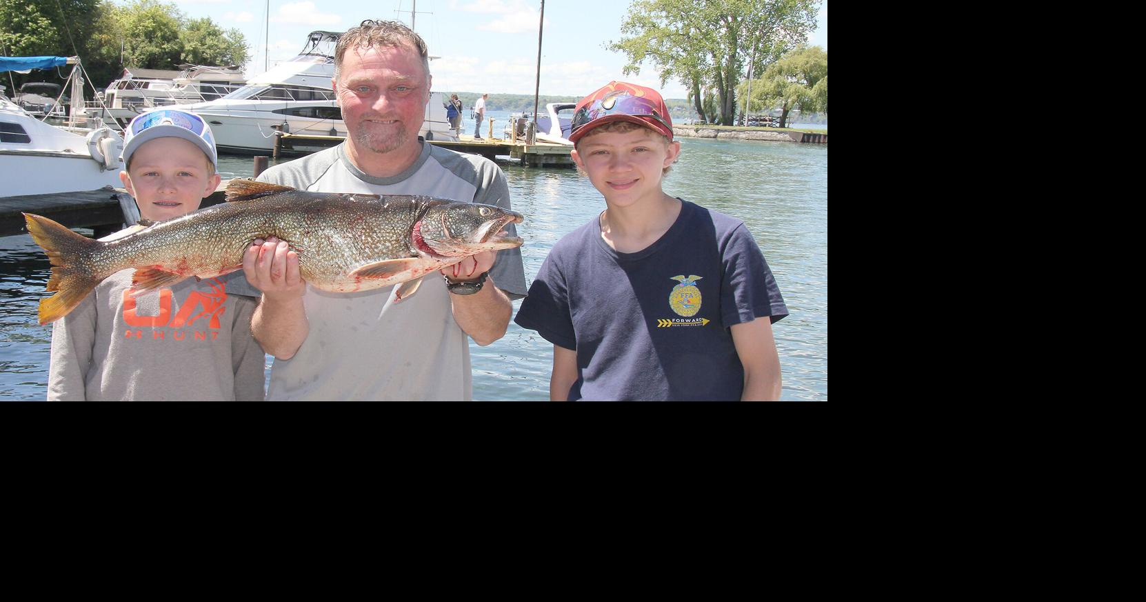 Final-day drama: Romulus father, sons reel in National Lake Trout Derby ...