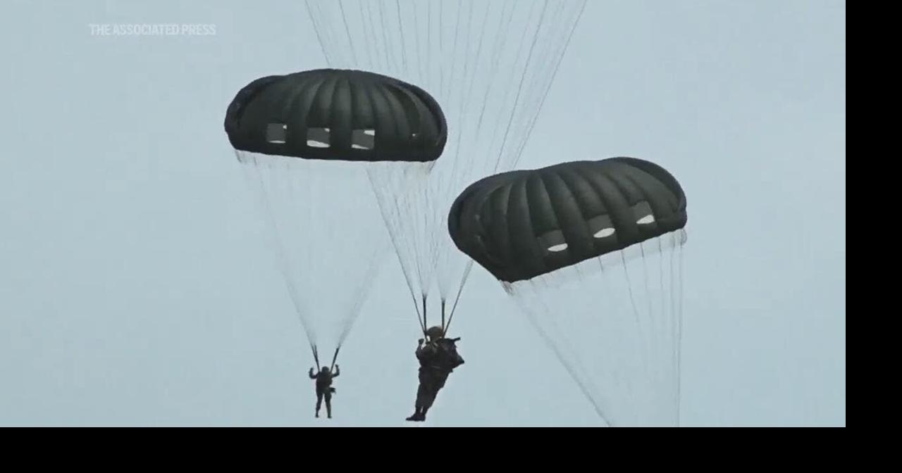 Parachutists recreate D-Day jumps from planes used in WWII operation to ...