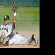 Zack Tapia shows the ball to the umpire on a close play at second base ...
