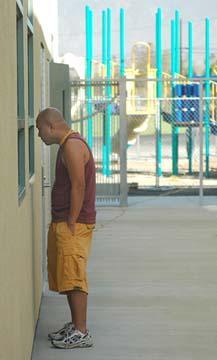 Chito Ramiro looks inside the classroom of his third grade son, C.J., 7 ...