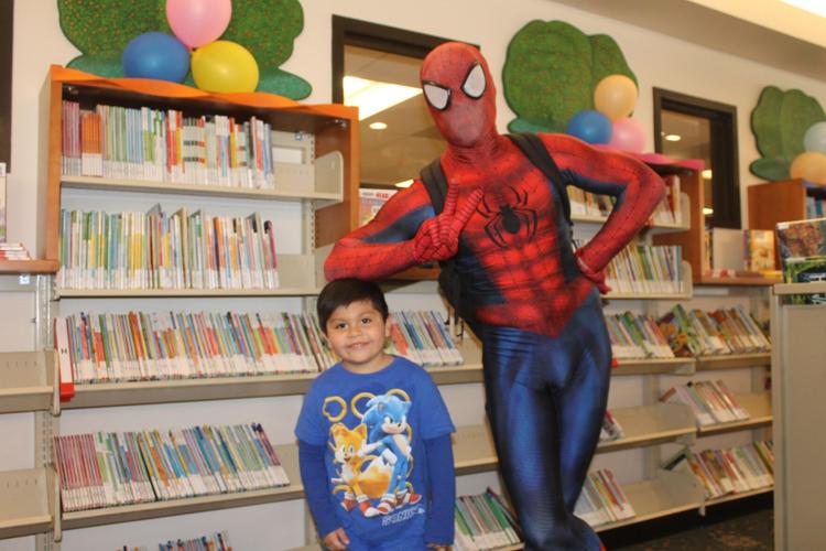 Families enjoy New Book Festival at Lewis Library in Fontana; see ...