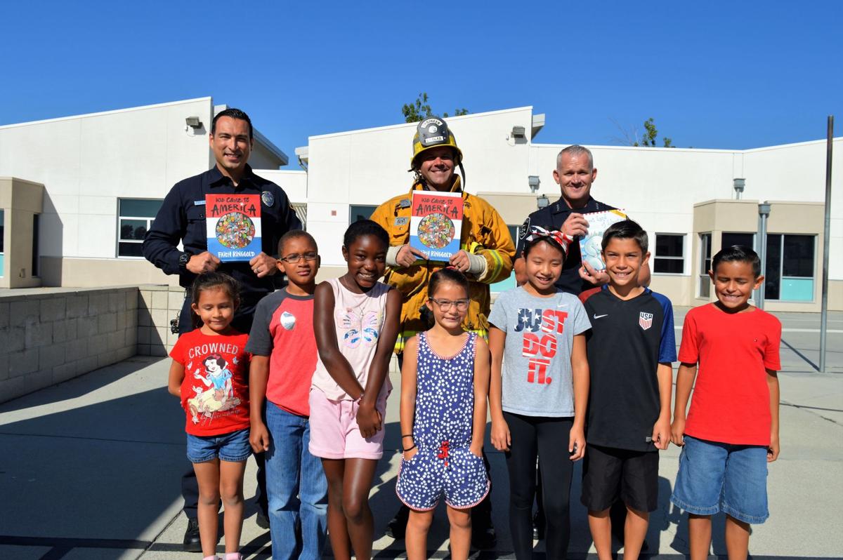 Officers, firefighters read patriotic books to students at D.W. Long ...